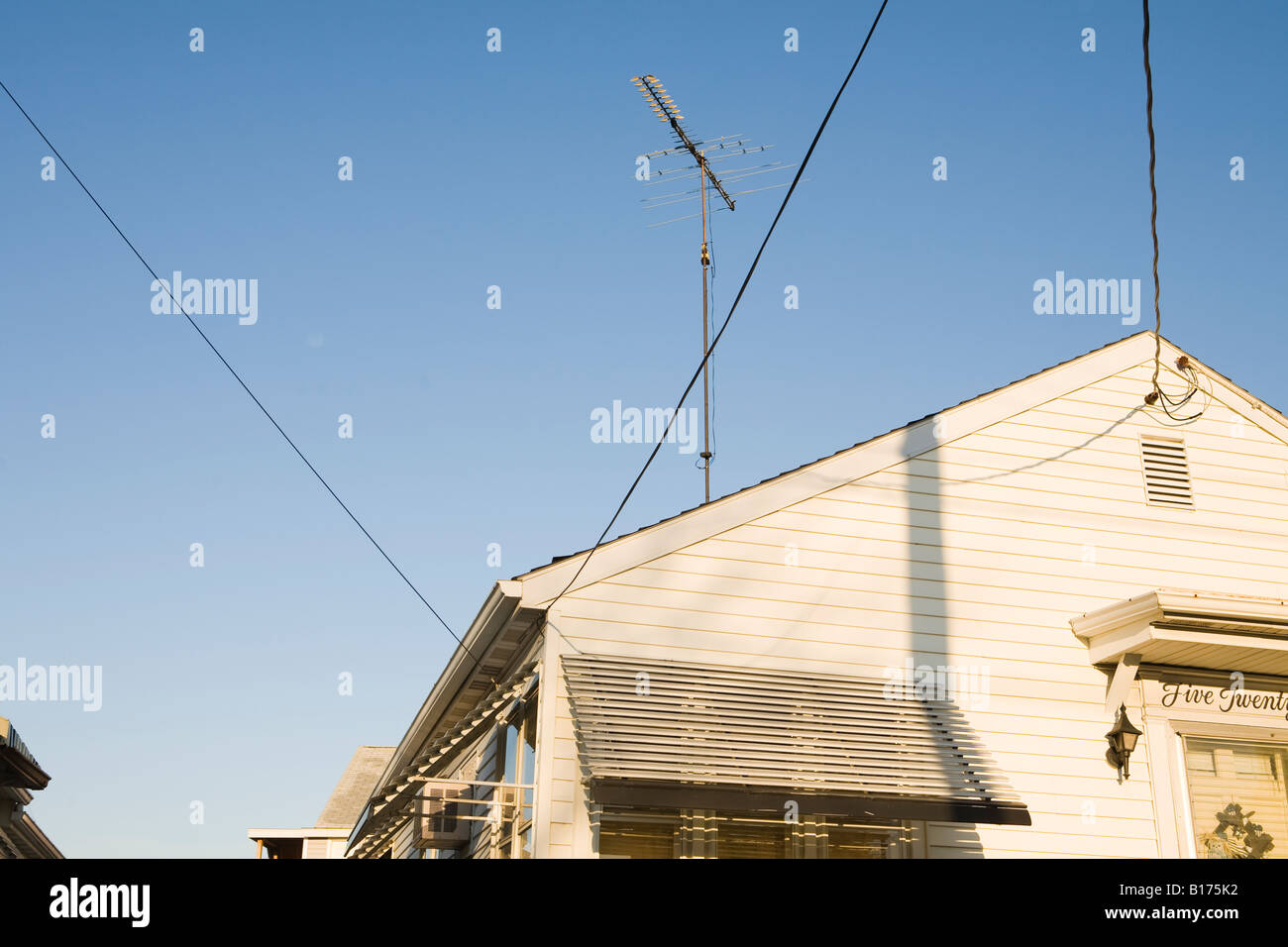 Top of a house with telephone wires Stock Photo - Alamy