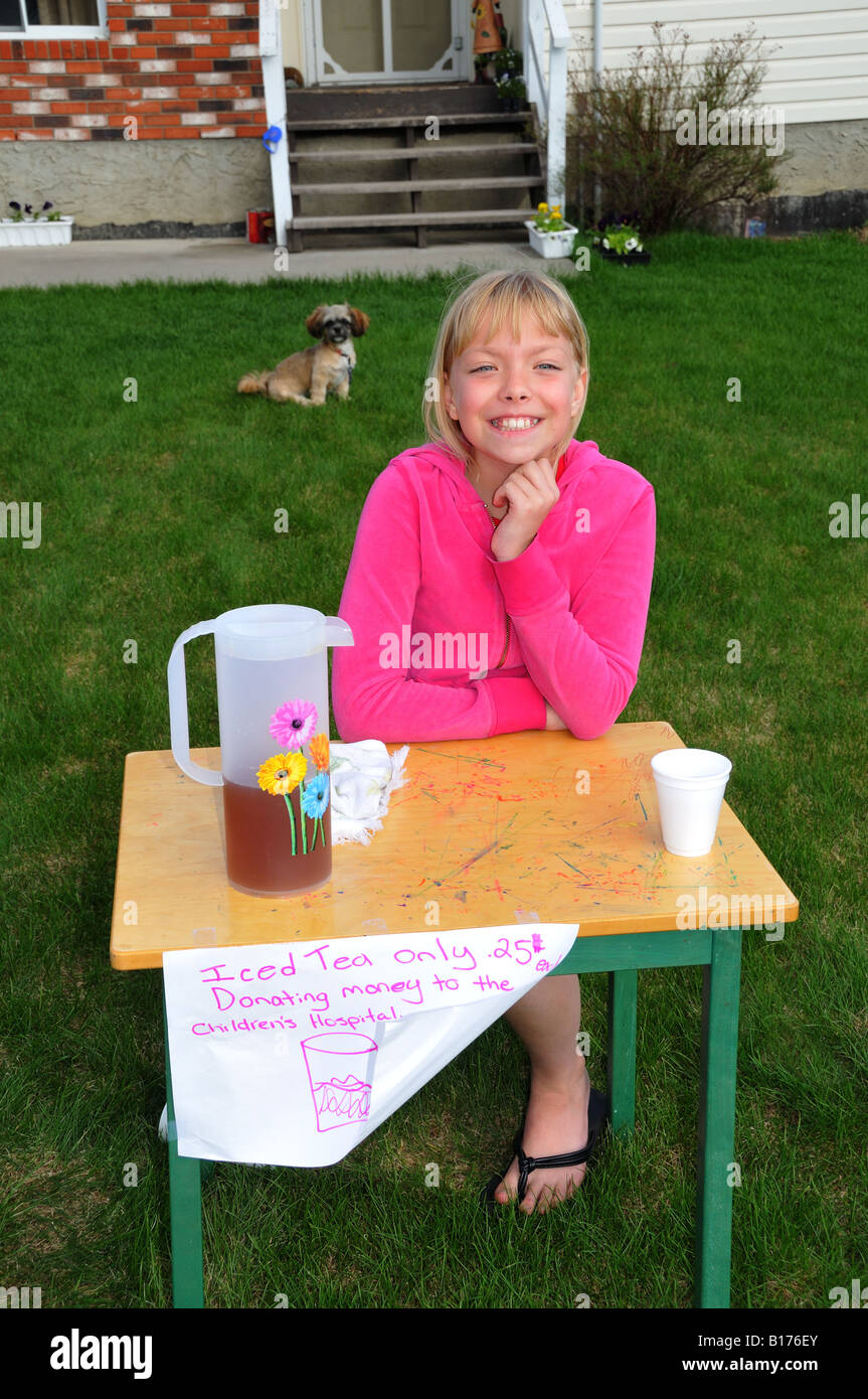 Blond girl selling ice tea Stock Photo - Alamy