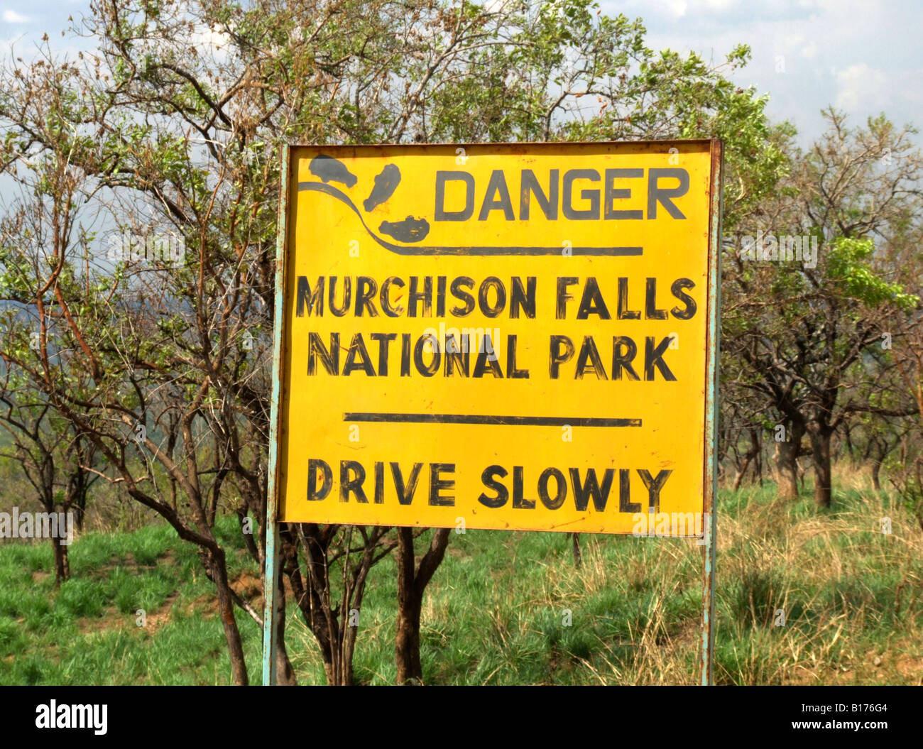 Signpost: Danger. Murchison Falls National Park. Drive slowly. Road ...