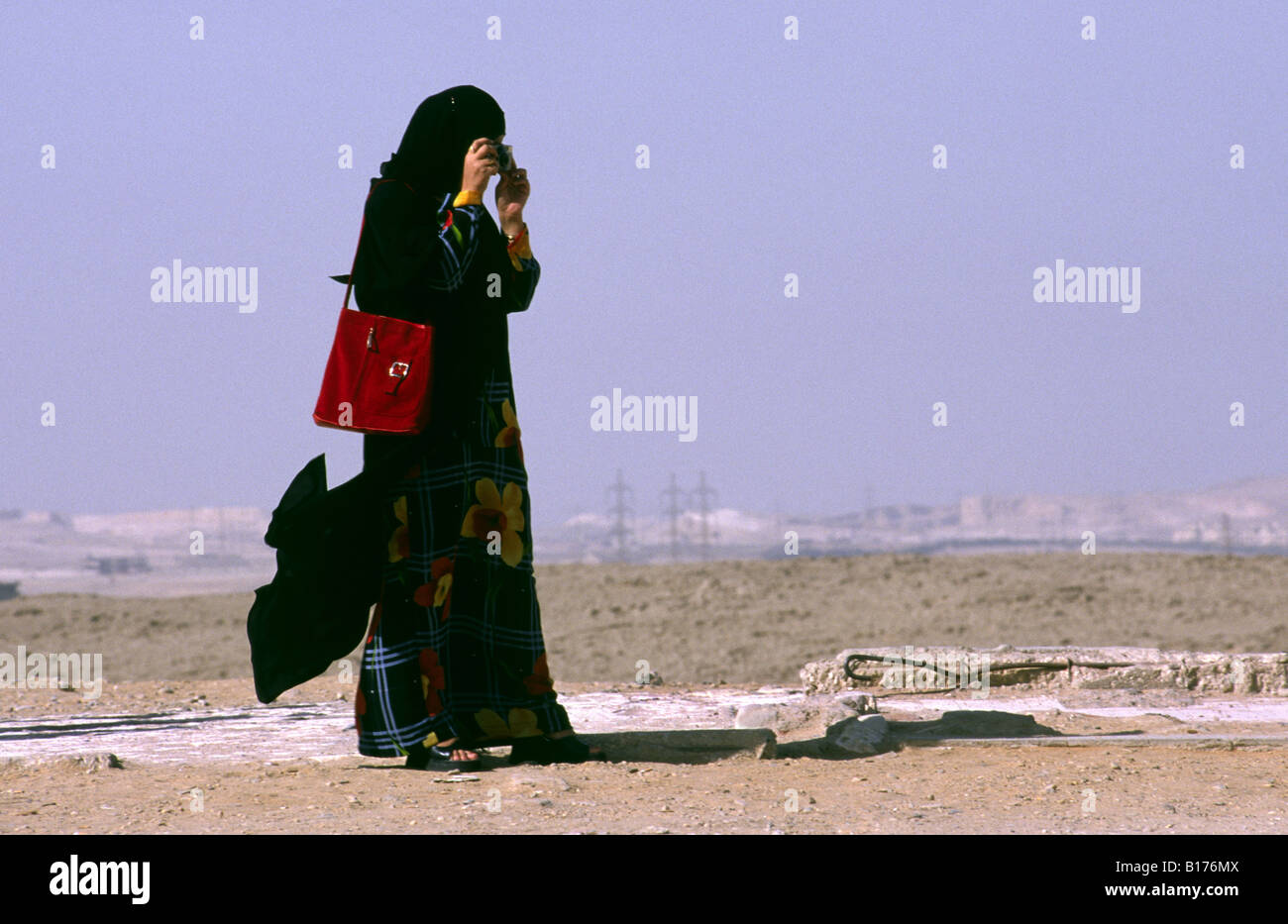 Woman in veil photographing Giza pyramids. Cairo, Egypt Stock Photo - Alamy
