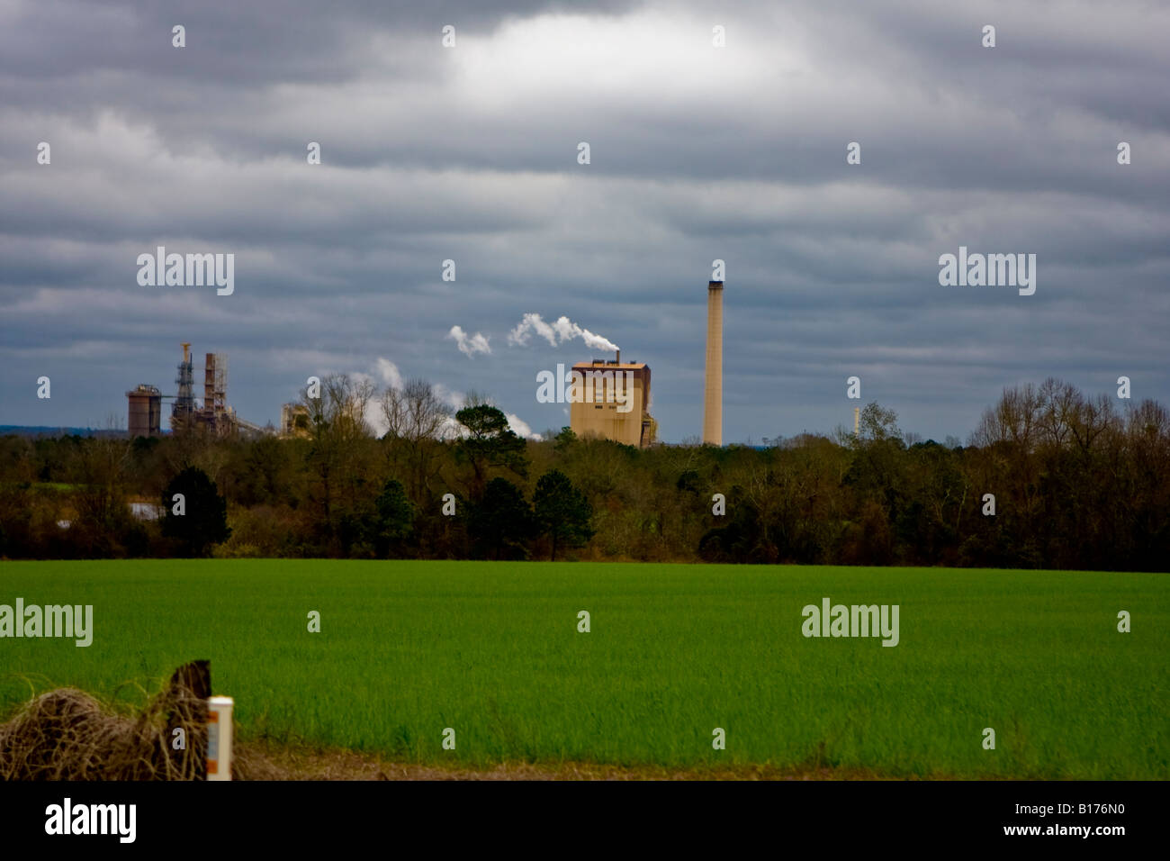 Industrial Buildings and Smokestack on the Horizon Stock Photo - Alamy