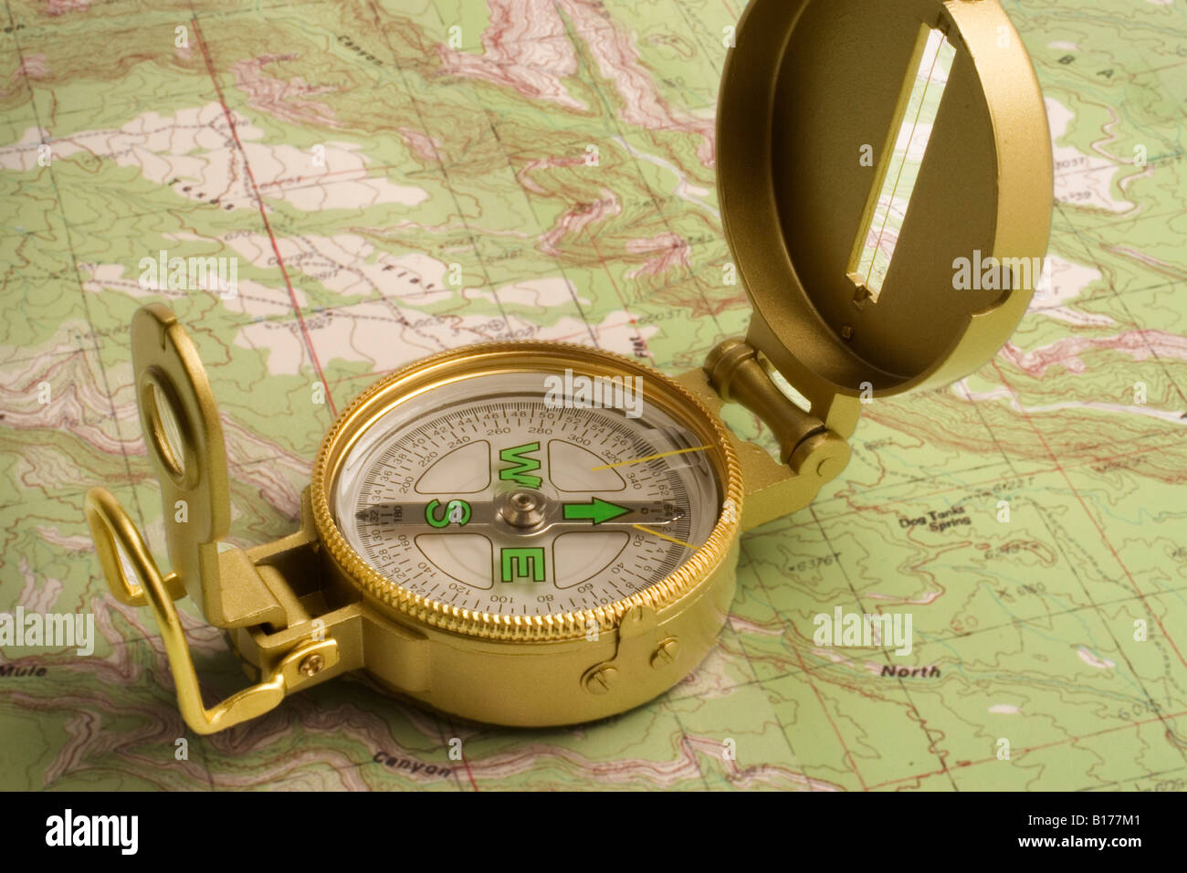Lensatic sighting compass on a topographic map Stock Photo - Alamy