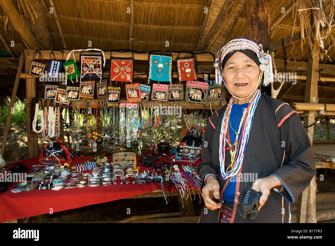 an old woman selling her traditionally made goods in her street stall ...