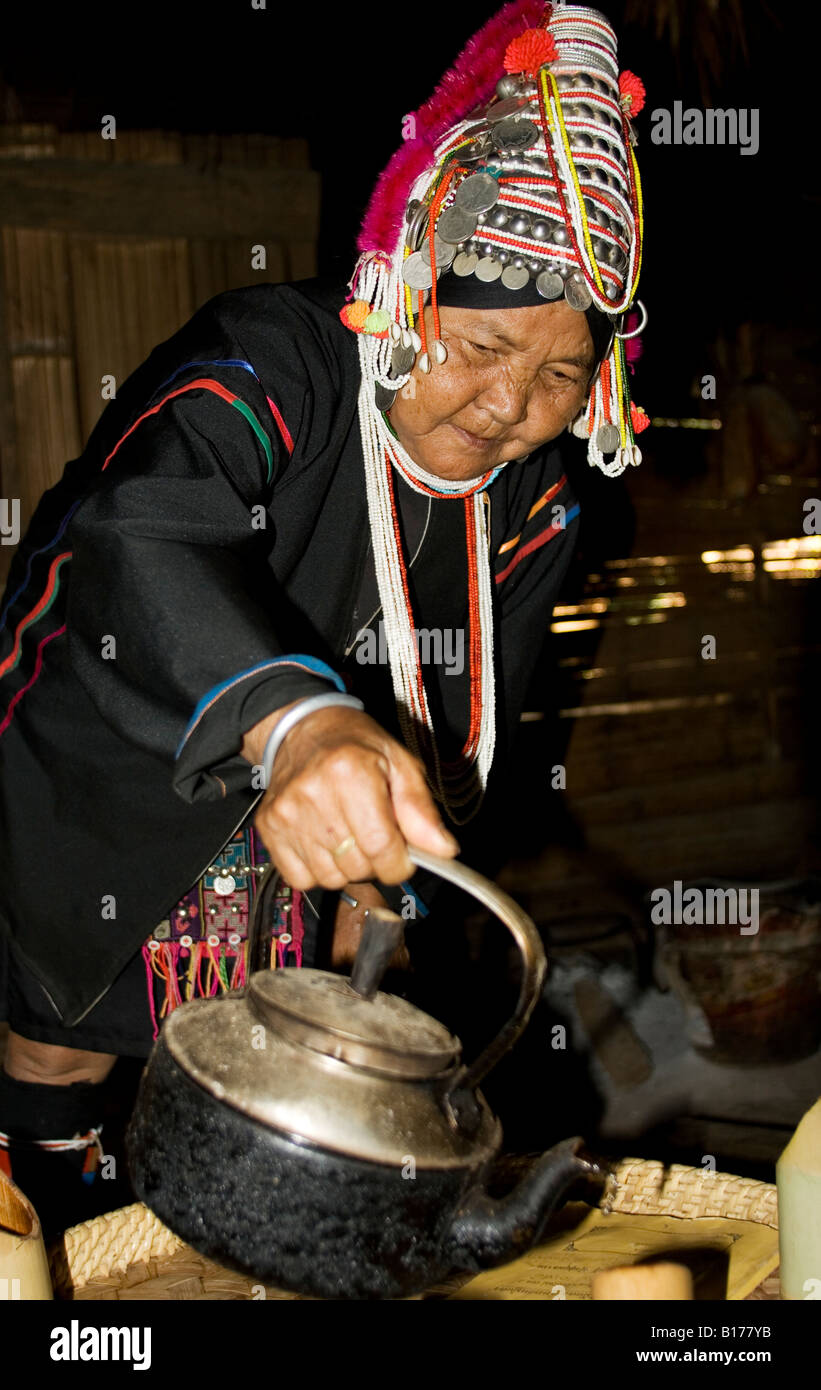 The Village Shaman pouring tea in her house Stock Photo - Alamy