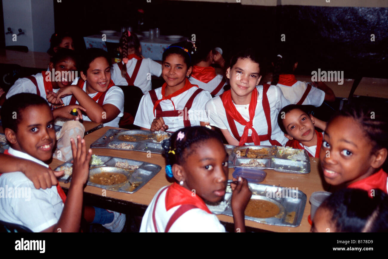 Cuban students eating lunch at the school cantin Stock Photo - Alamy