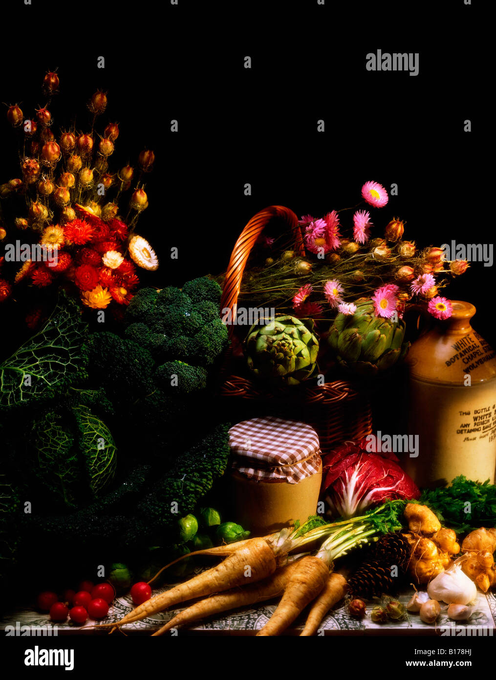 Still life with vegetables and flowers Stock Photo - Alamy
