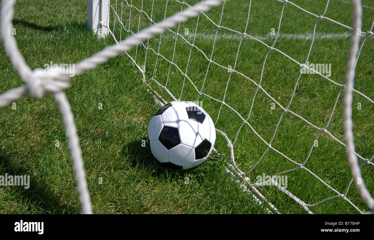 Soccer ball in the goal net Stock Photo - Alamy