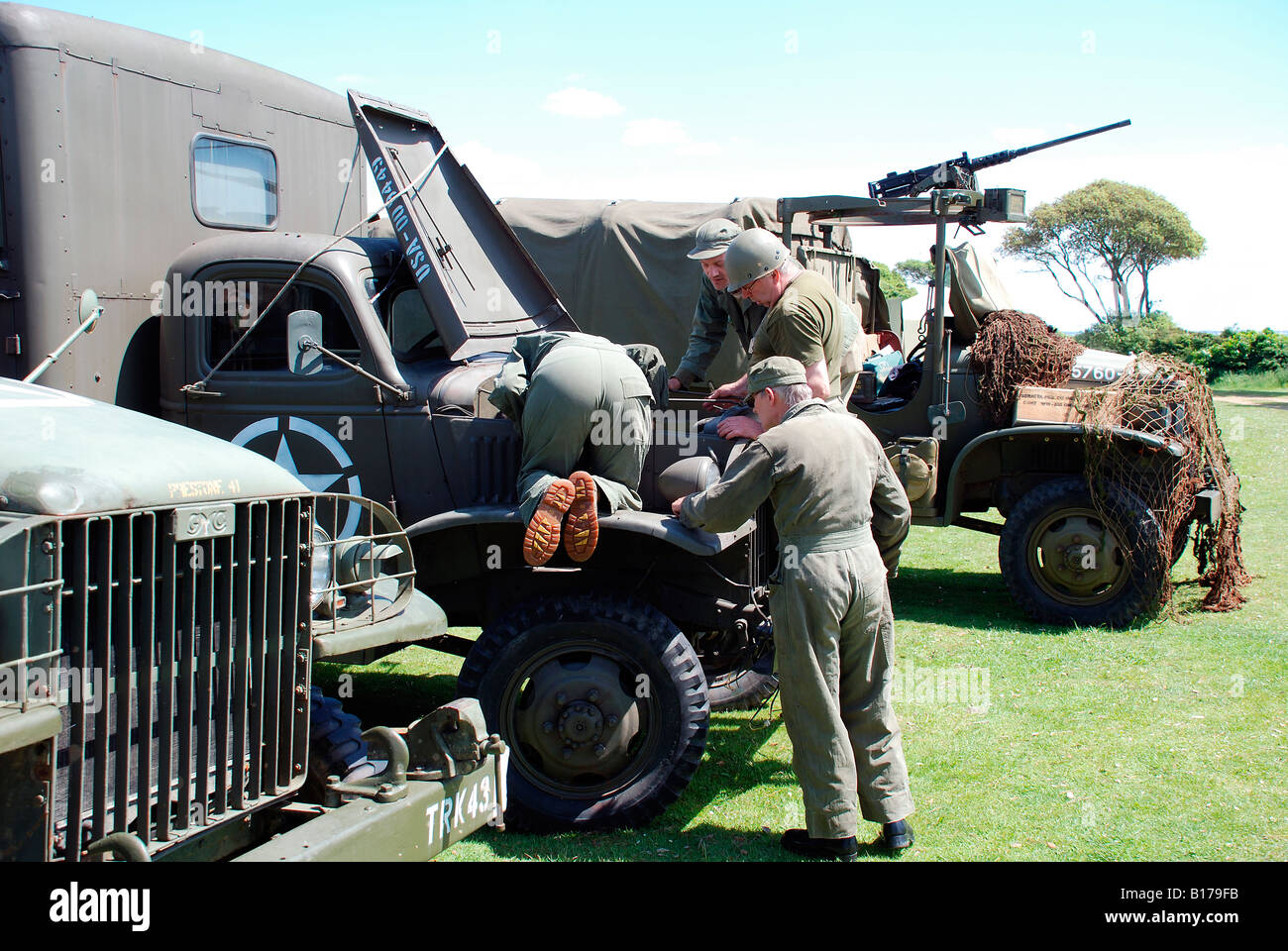 WW2 mechanics working on lorry at D-day reenactment lepe beach ...