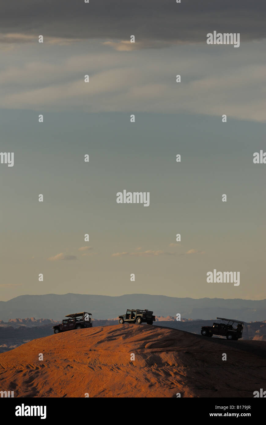 Hummer jeeps on the slick rock trail near Moab Utah at sunset USA Stock ...