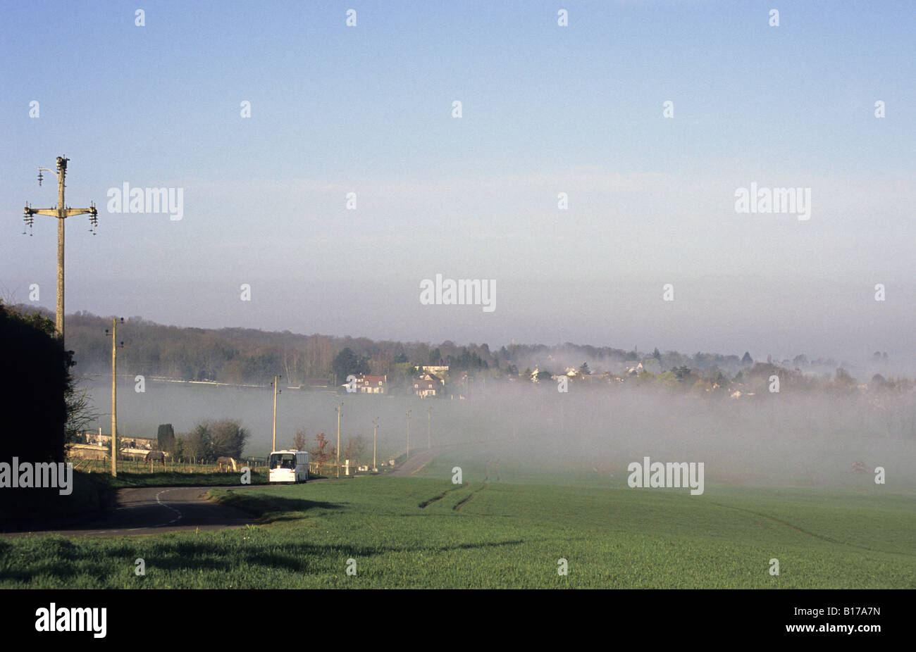 France Maurepas early morning mist fog bus drive Stock Photo - Alamy