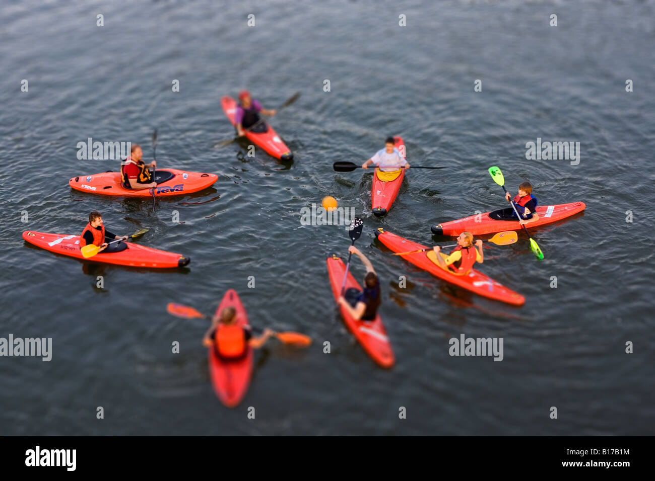 Canoeists playing a ball game on the River Neckar near Heidelberg ...