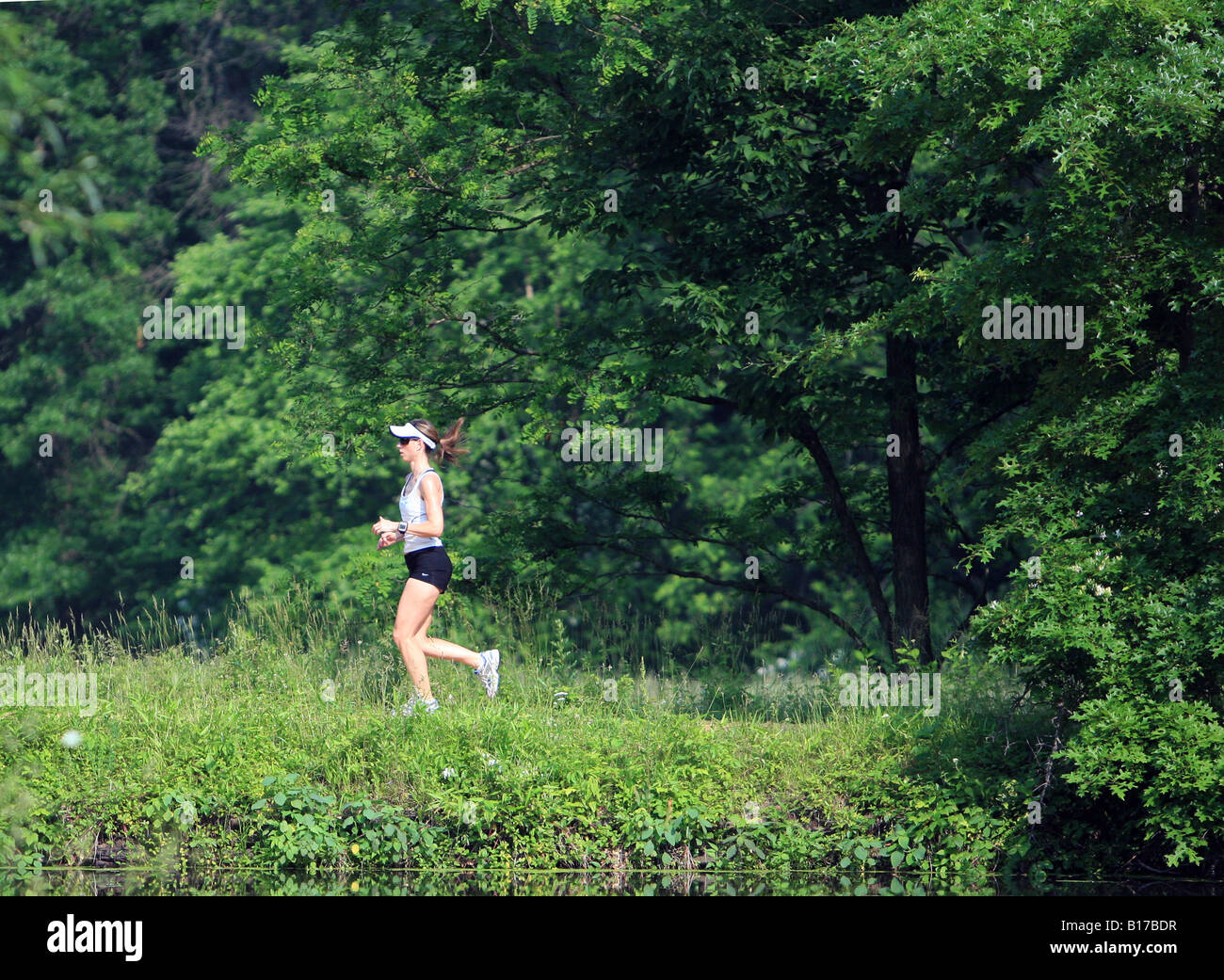 Female running in forest hi-res stock photography and images - Alamy