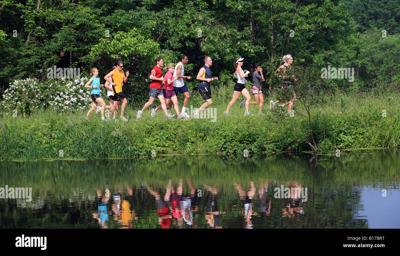 Group people running through forest hi-res stock photography and images ...