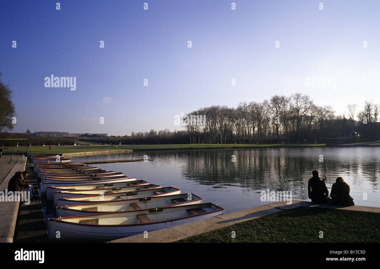 Versailles park canal with tourist boats in sunset Stock Photo - Alamy