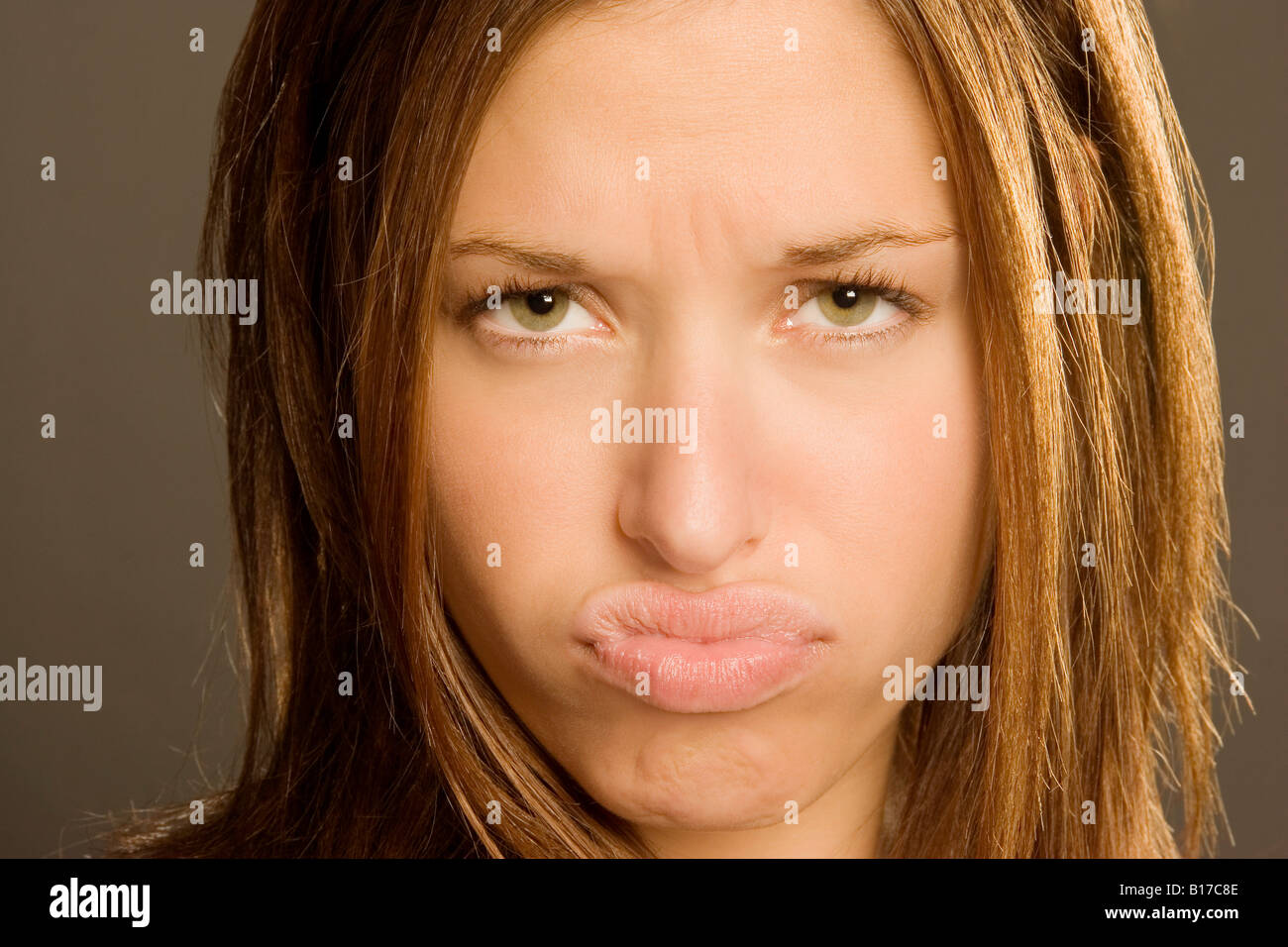 Brunette model pouting Stock Photo - Alamy