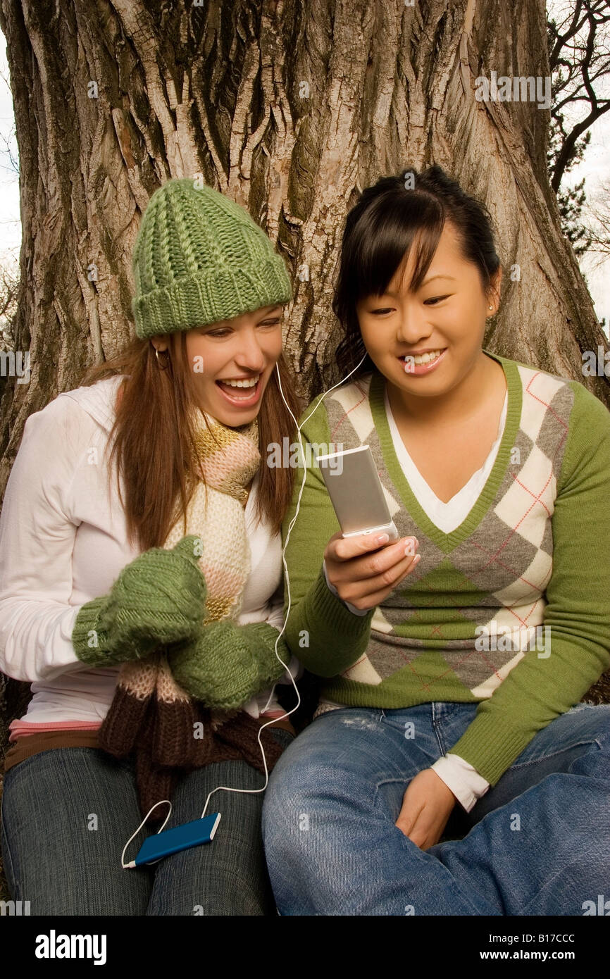 Teenagers all with mobiles sitting hi-res stock photography and images ...