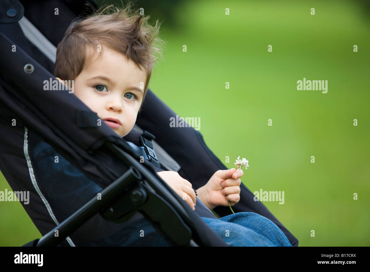 Boy in stroller Stock Photo - Alamy