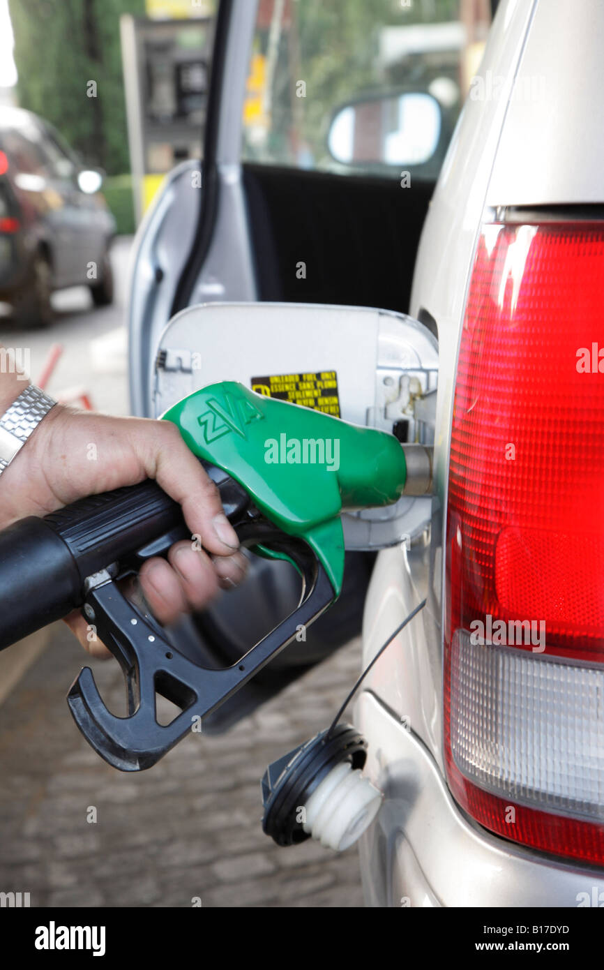 petrol pump filling car on filling station forecourt Stock Photo - Alamy