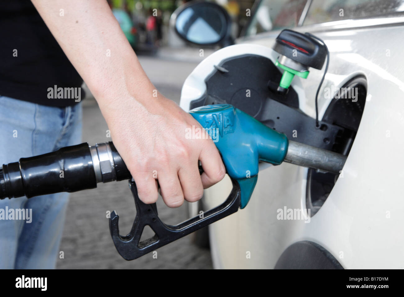 person refuelling car with petrol Stock Photo - Alamy