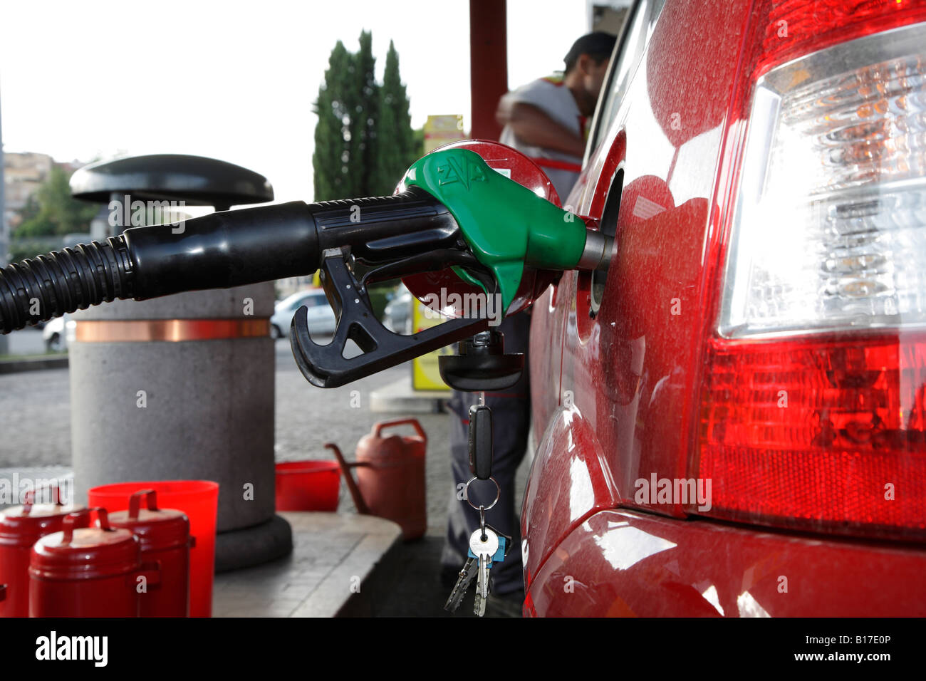 petrol pump filling car on filling station forecourt Stock Photo - Alamy