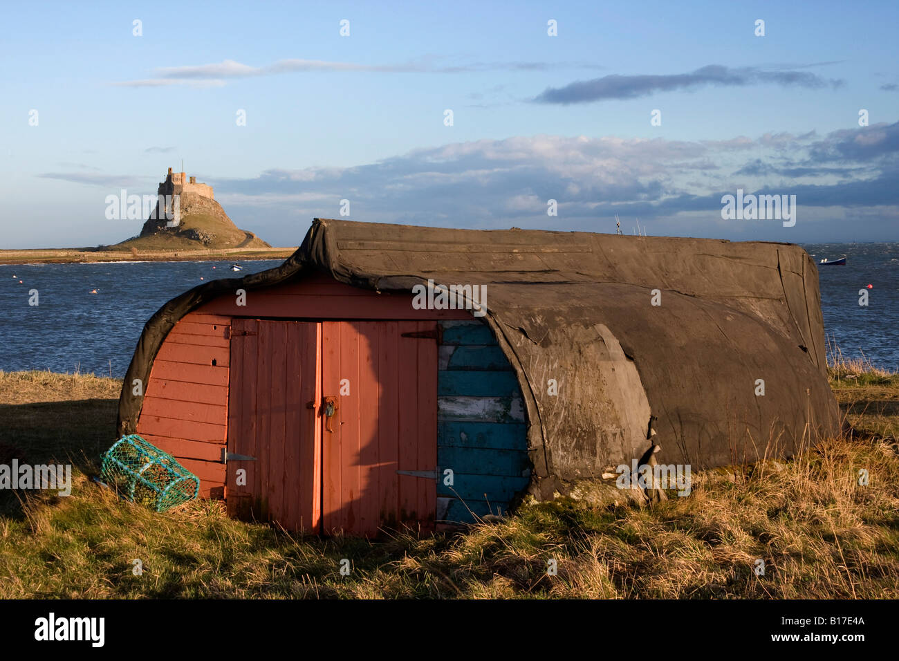 Barn beside volcanic mound called Beblowe Craig, England Stock Photo ...