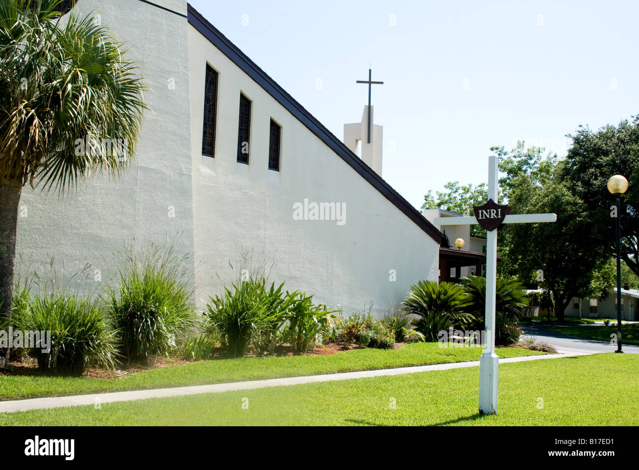 Two crosses by a white church Stock Photo - Alamy