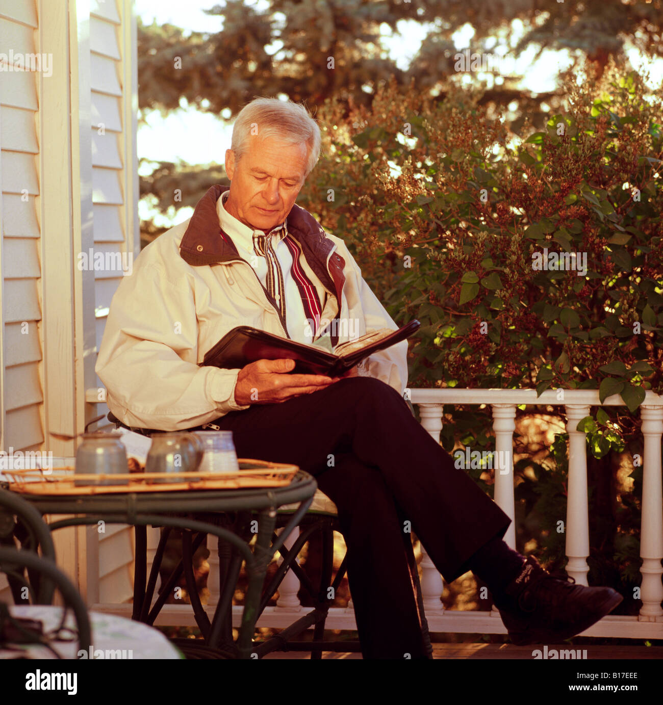 A man reading his Bible Stock Photo - Alamy