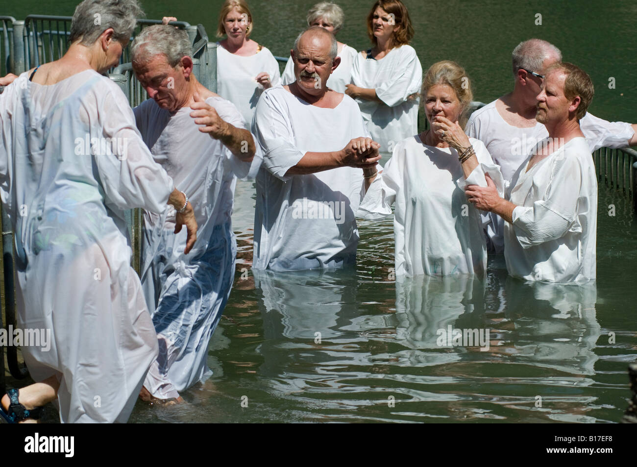 Christian pilgrims undergo baptism by immersion in Yardenit Baptismal ...