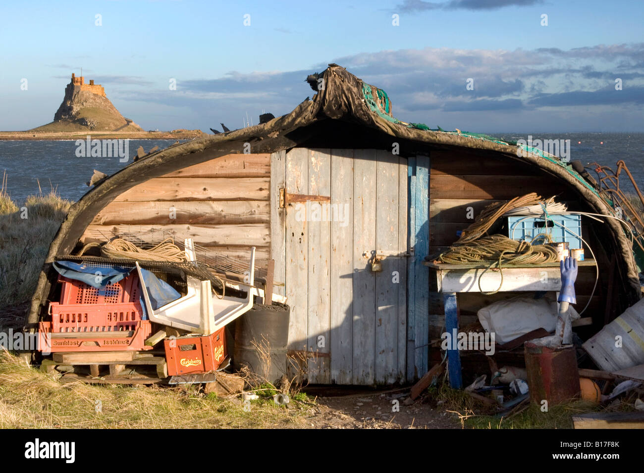 Barn beside volcanic mound called Beblowe Craig, England Stock Photo ...