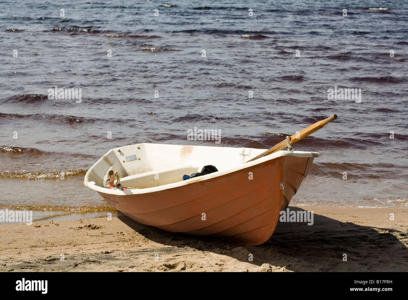stranded row boat Stock Photo - Alamy