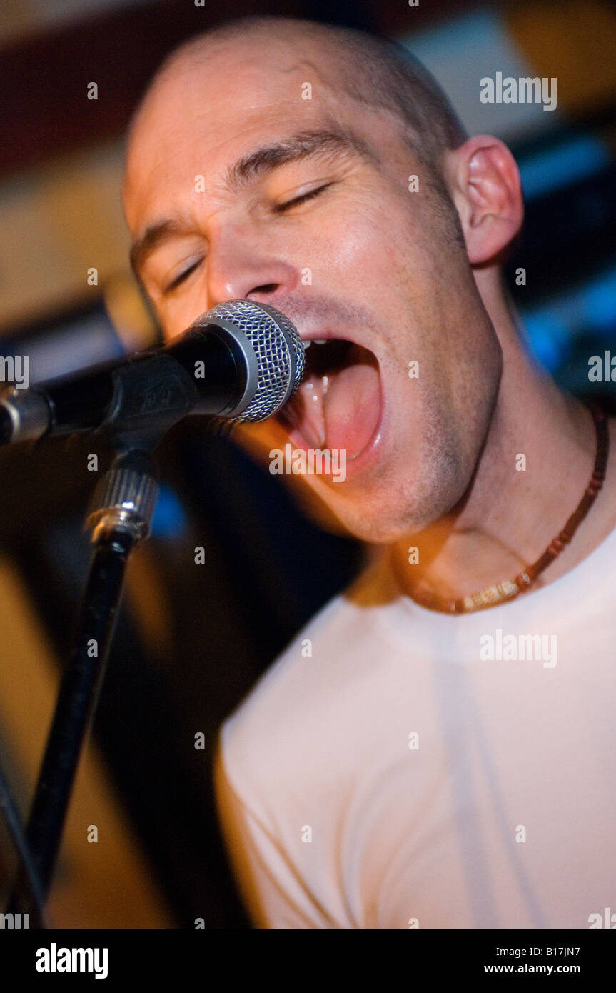 Rock band vocalist Stock Photo - Alamy