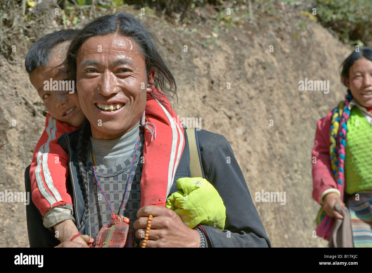 Tibetan family on a pilgrimage to a holy waterfall, Yubeng, Yunnan ...