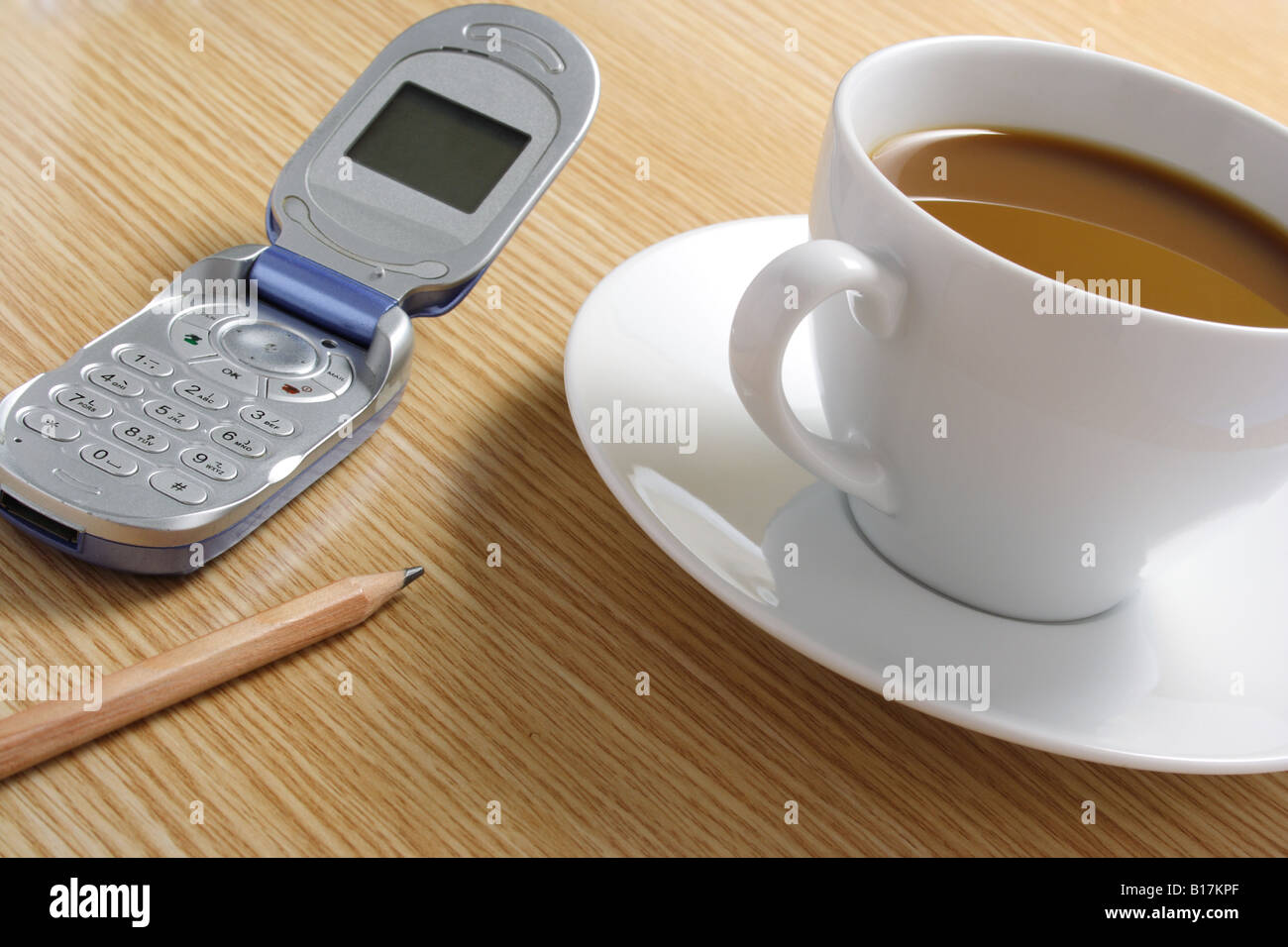 Coffee Pencil and Cellphone on Desk Stock Photo - Alamy