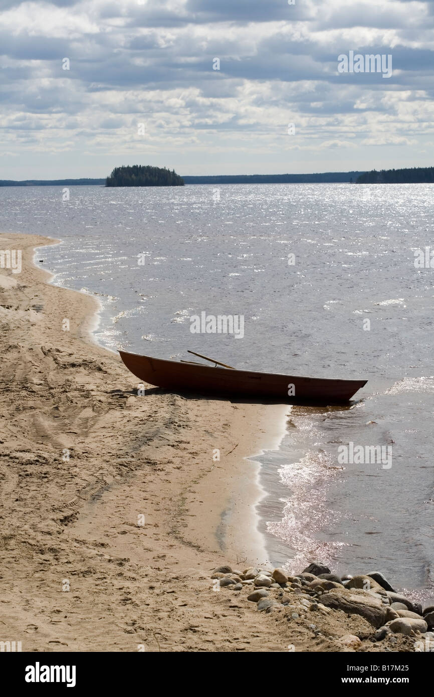 stranded row boat Stock Photo - Alamy