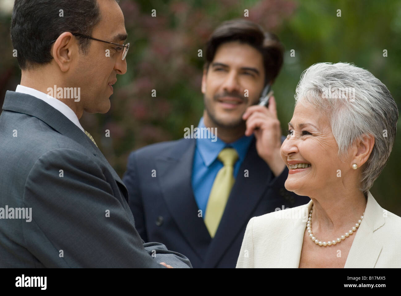 Hispanic businesspeople talking Stock Photo - Alamy