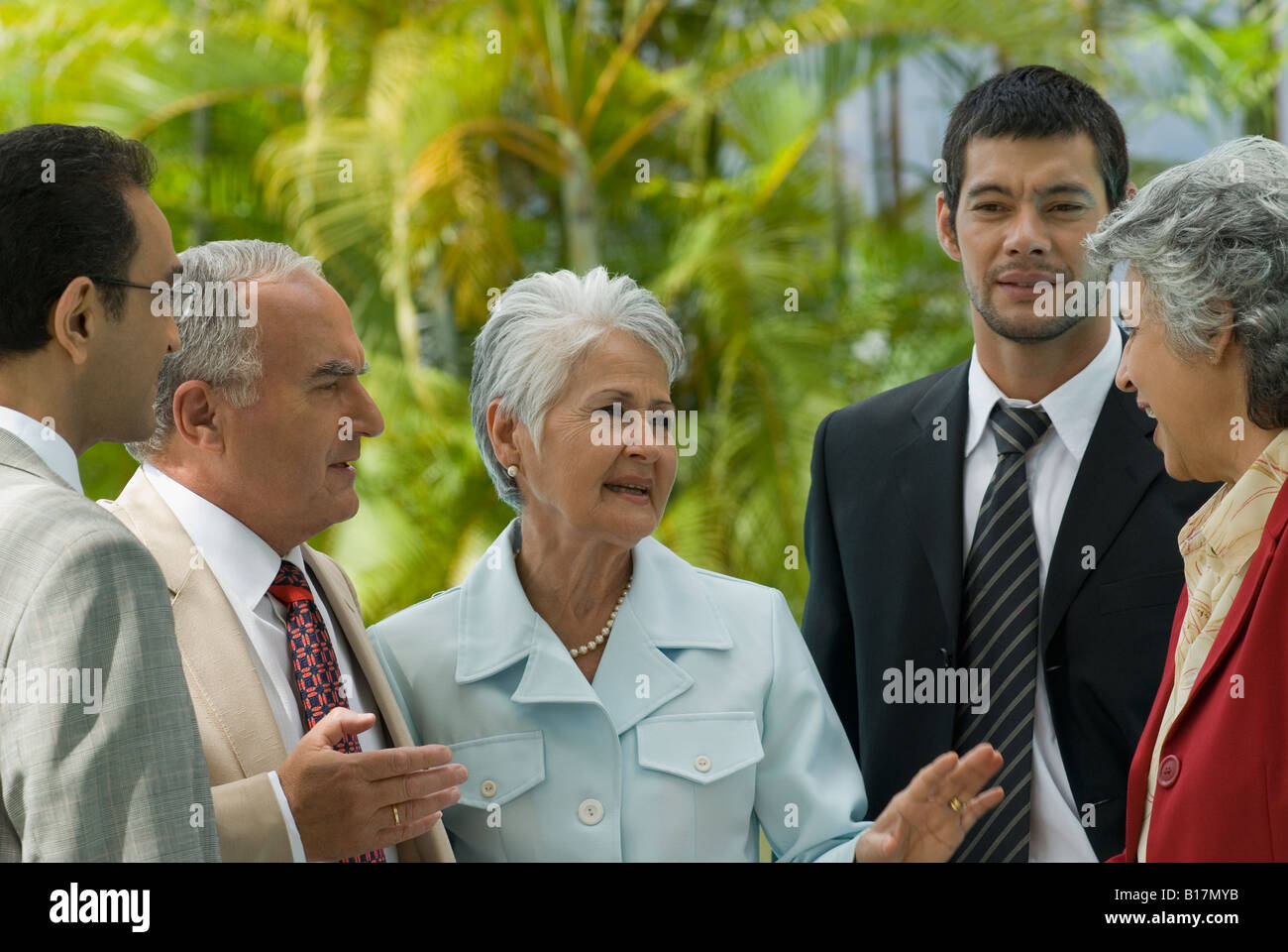 Hispanic businesspeople talking Stock Photo - Alamy