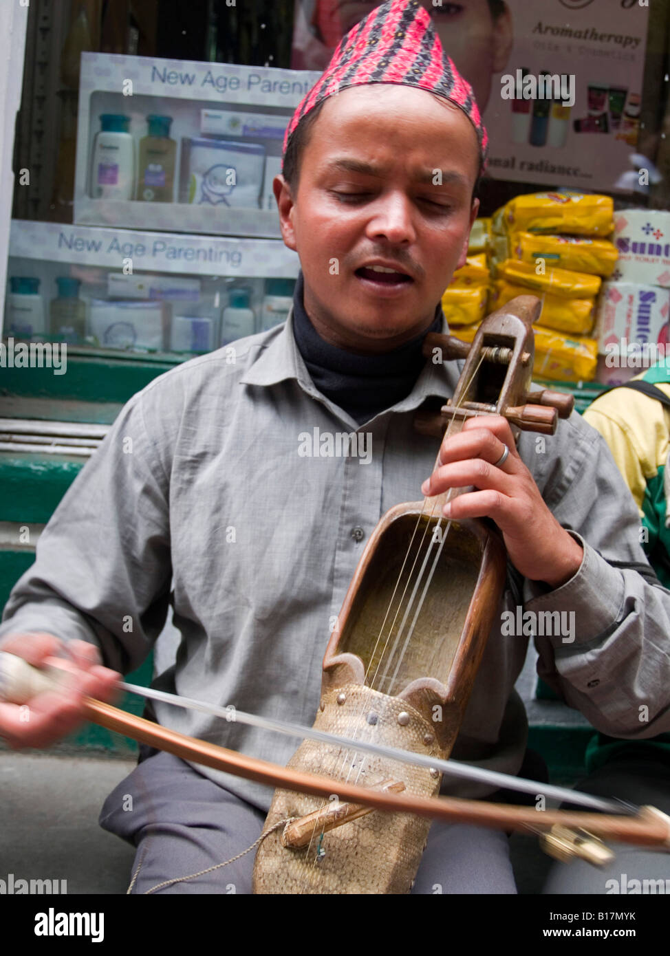 Nepali musician playing traditional instrument Stock Photo - Alamy