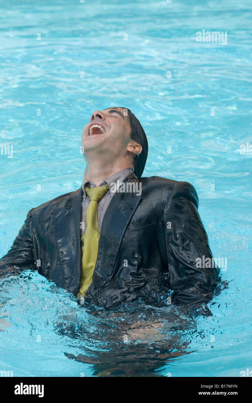 Hispanic businessman in swimming pool Stock Photo - Alamy