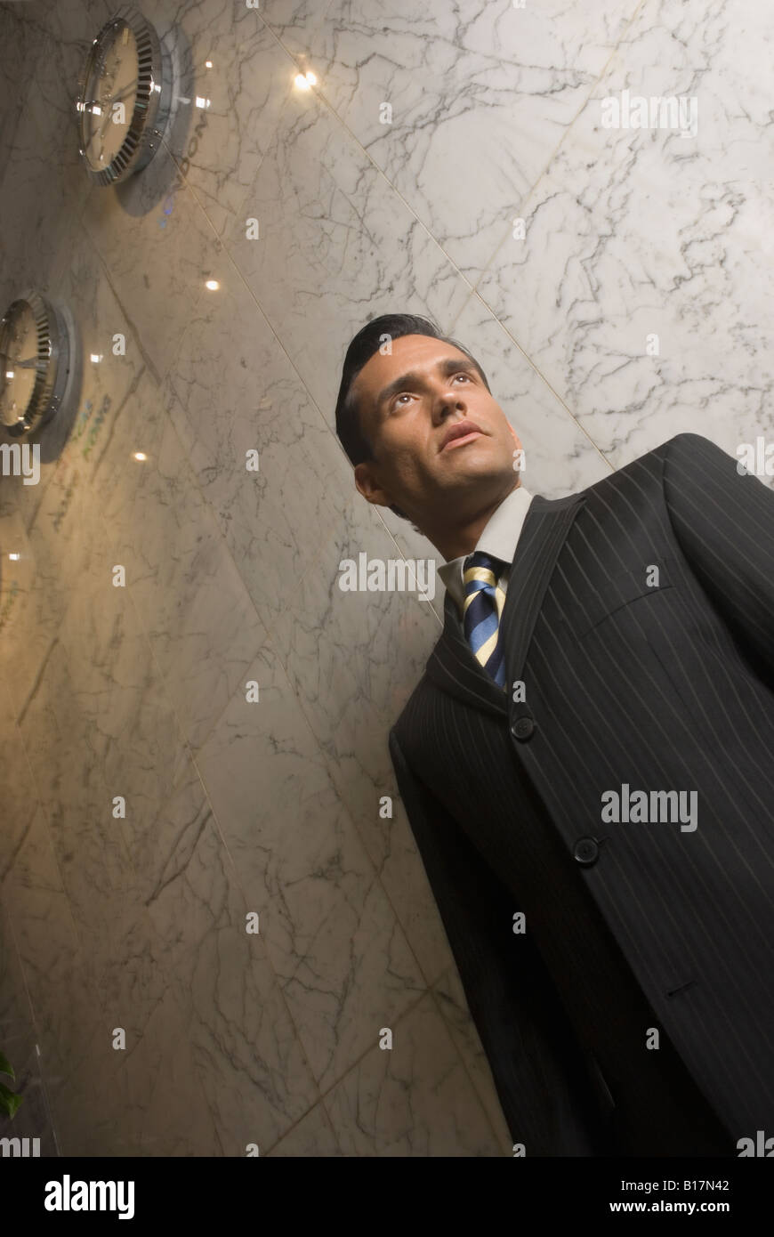Low angle view of Hispanic businessman Stock Photo - Alamy