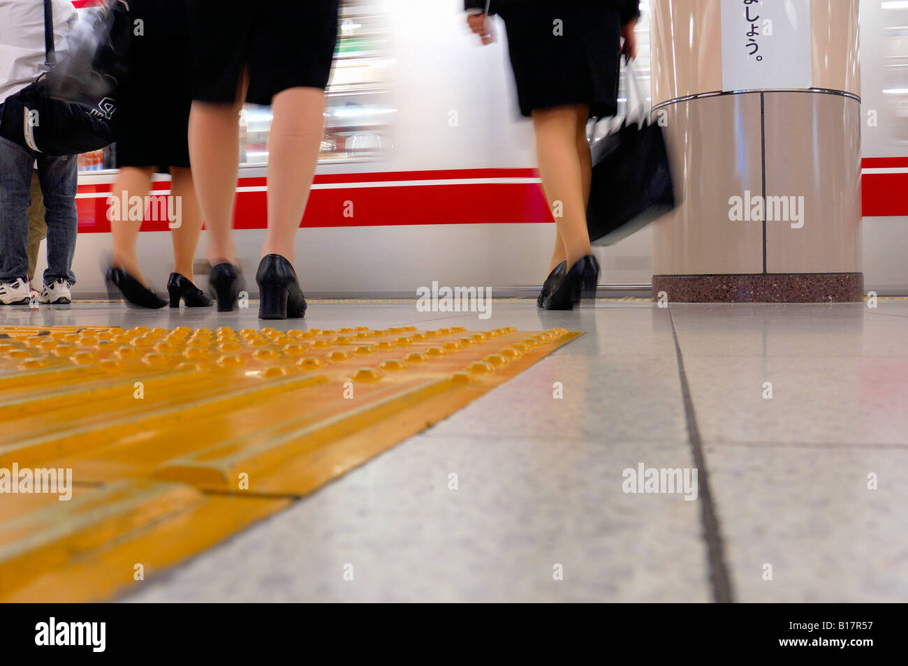 female commuters waiting on subway train Tokyo Japan Stock Photo - Alamy