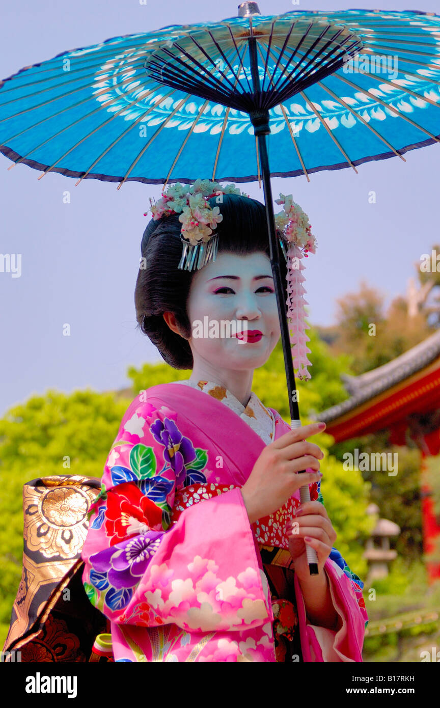 maiko apprentice geisha with umbrella at Kiyomizu Temple Kyoto Japan ...