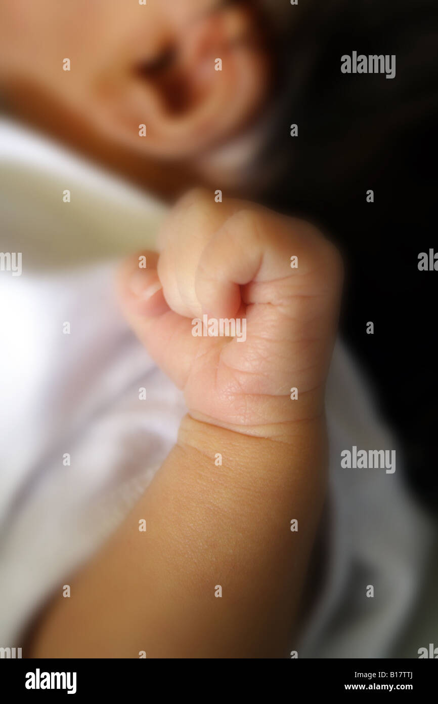 Baby's clenched fist Stock Photo - Alamy
