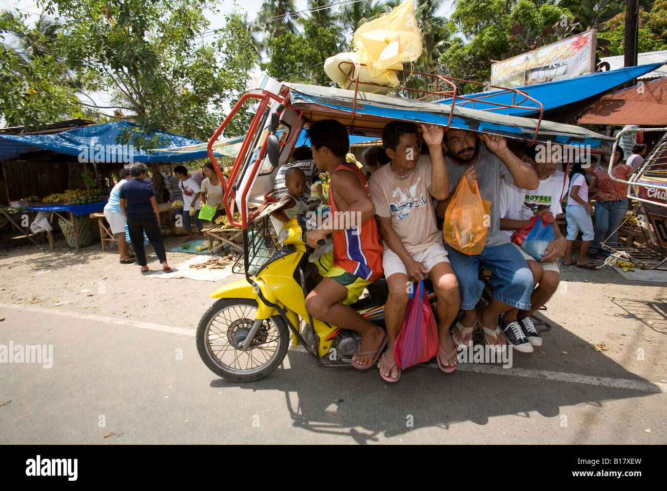 local tricycle carrying people at the market Dumaguete Apo Island ...