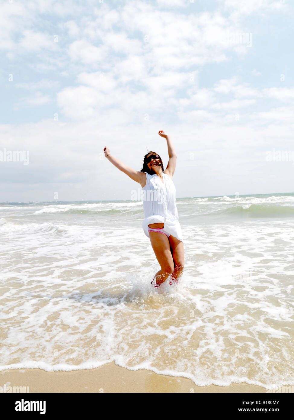 Young Woman Jumping in the Sea Model Released Stock Photo - Alamy