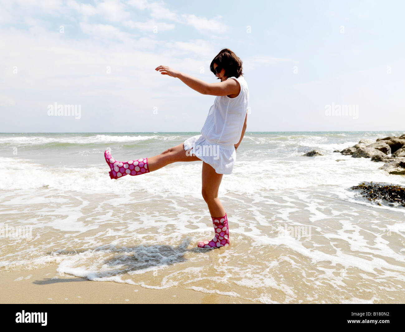 Young Woman Playing in the Sea Model Released Stock Photo - Alamy