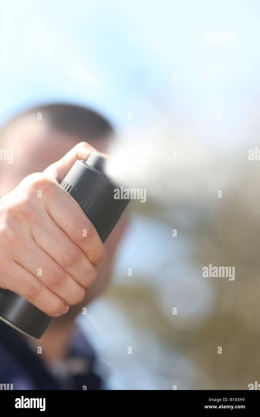 Man Spraying CS Gas Model Released Stock Photo - Alamy