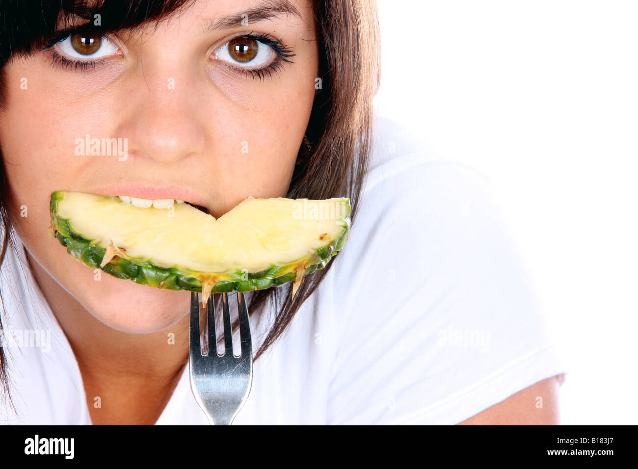 Young Woman Eating Pineapples Model Released Stock Photo - Alamy
