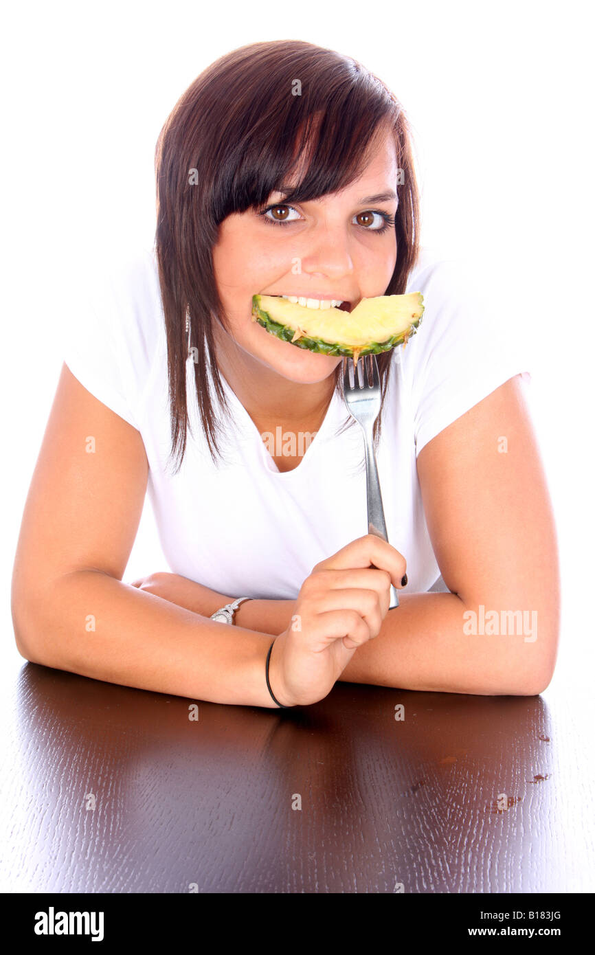 Young Woman Eating Pineapples Model Released Stock Photo - Alamy