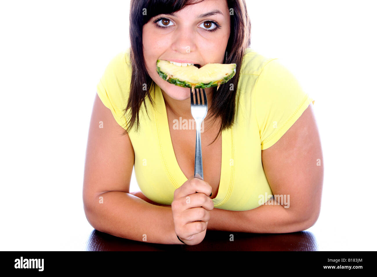 Young Woman Eating Pineapples Model Released Stock Photo - Alamy