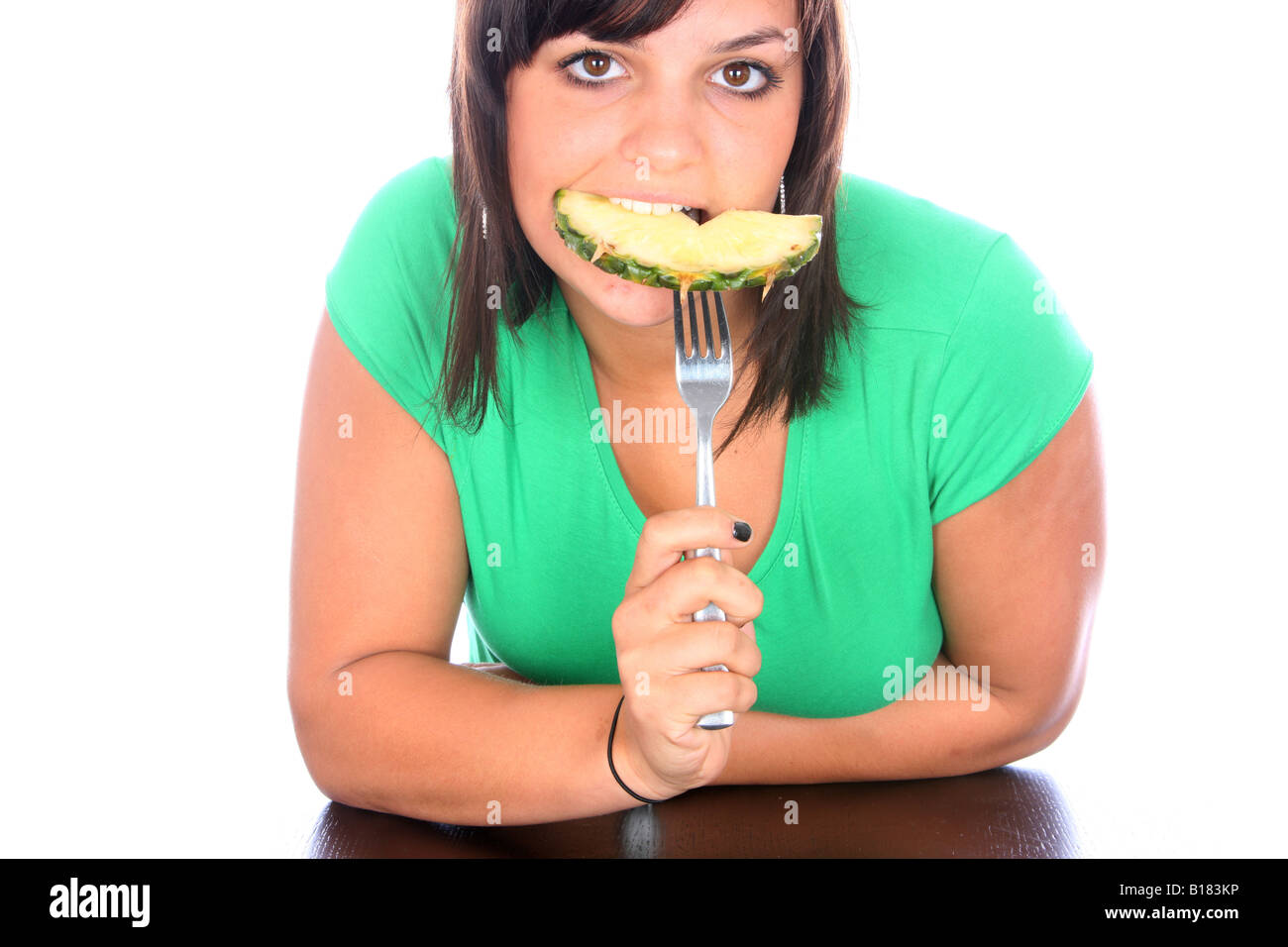 Young Woman Eating Pineapples Model Released Stock Photo - Alamy